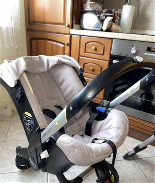 Коляска автокресло Doona с базой isofix