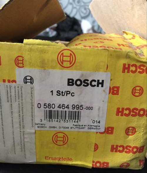 Бош оригинал. Насос топливный Bosch в желтой упаковке. Насос бош на пачку. Бош в желтой коробке и синей.