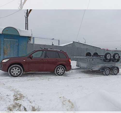 Прицеп бортовой для снегоходов.Две оси