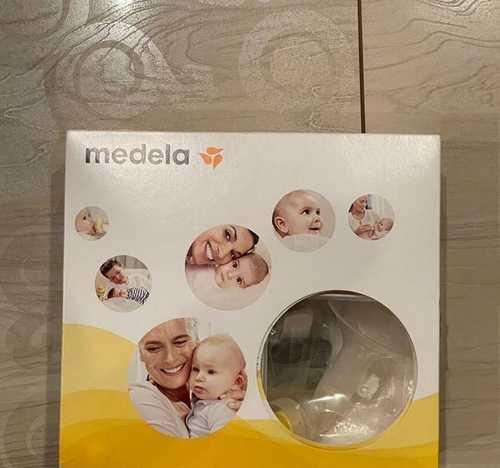 Молокоотсос Medela электрический