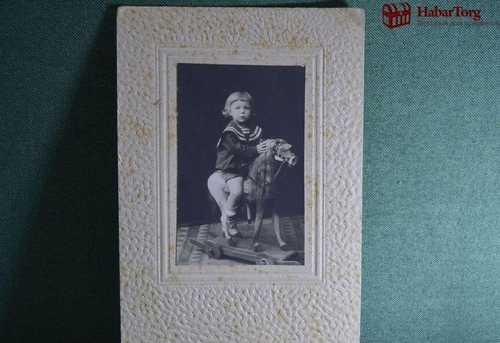 Фотография старинная "Мальчик на деревянной лошадк