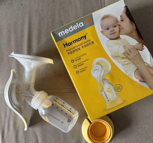 Молокоотсос ручной новый medela