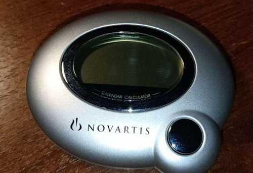Novartis Часы-календарь-калькулятор