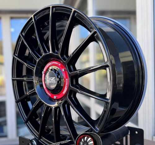 Диски oz racing r17 4x100 4x114.3 черный глянец