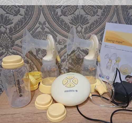 Молокоотсос medela swing maxi