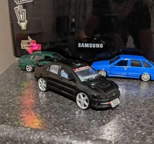 Модель автомобиля lancer evolution 7 kinsmart 1:36