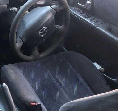 Руль mazda familia