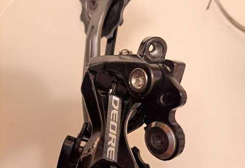 Задний переключатель shimano deore 9 скоростей