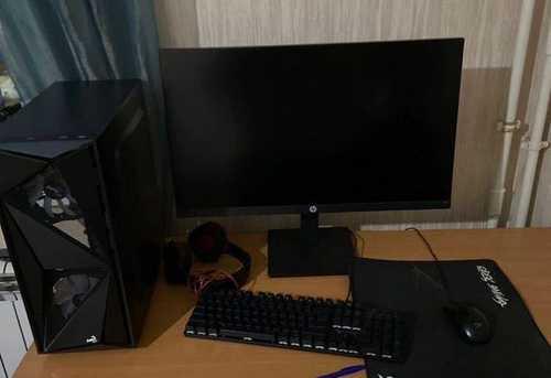 Игровой компьютер с монитором и креслом