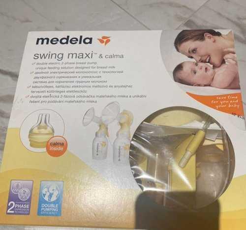 Молокоотсос medela электрический