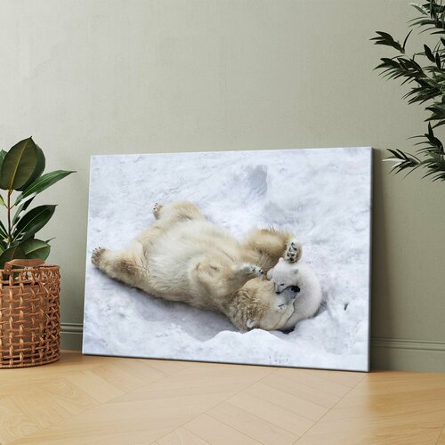 Картина на холсте (Белый медведь катается по снегу) 20x30 см. Интерьерная, на стену.