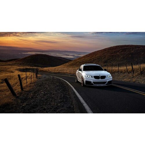 Картина на холсте 60x110 LinxOne "BMW Garde Car Front Sunset" интерьерная для дома / на стену / на кухню / с подрамником